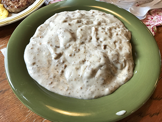 Biscuits and gravy: the South's greatest contribution to breakfast, where peppery cream sauce becomes a warm blanket for pillowy baked dough.