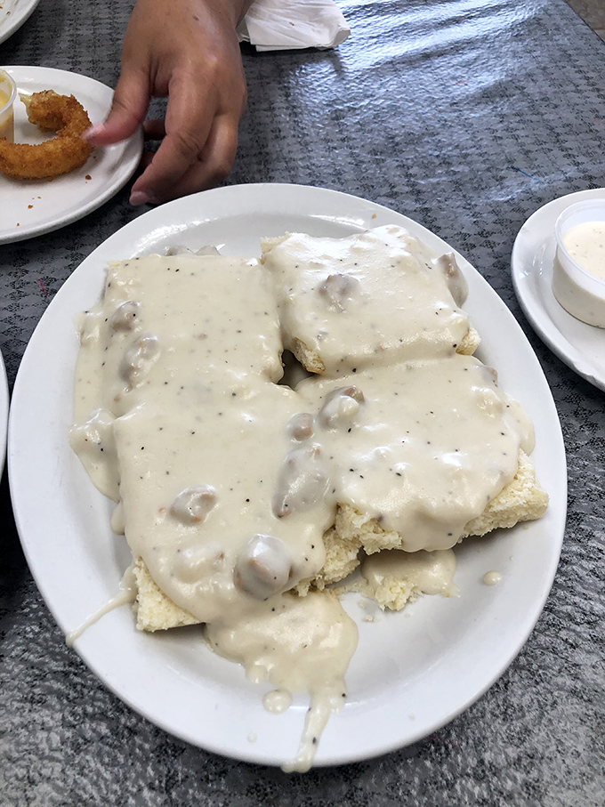 Biscuits and gravy so good they should require a permission slip&mdash;pillowy clouds of dough swimming in creamy, sausage-studded heaven.