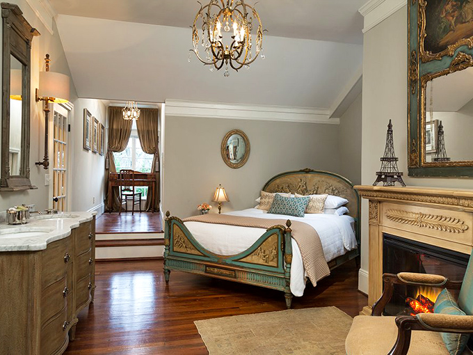 Parisian charm meets Southern comfort in this elegant suite. The antique bed and marble fireplace create a retreat that's both timeless and utterly relaxing.