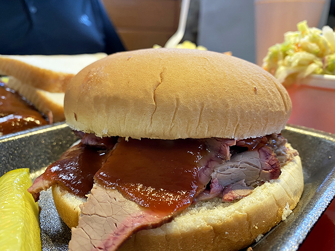 The brisket sandwich&mdash;where smoke-kissed meat nestles between bread that knows its job is to stay humble and hold on tight.