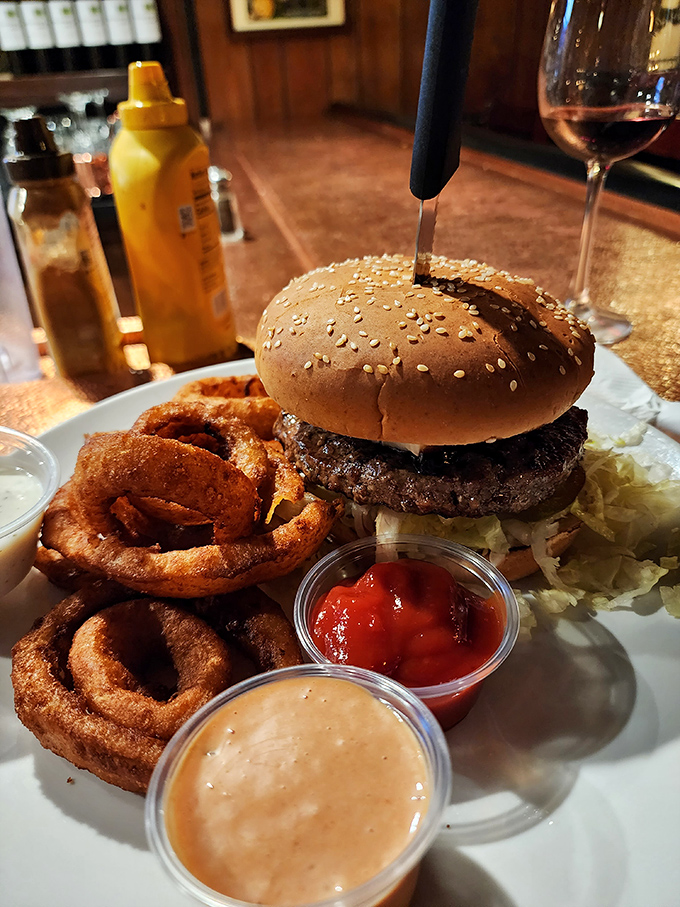A burger that requires both hands and a strategy. Those onion rings are the supporting actors who steal the show.