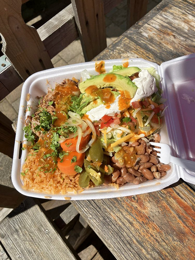 The burrito bowl presents a colorful landscape of flavors where every forkful offers a different combination of textures and tastes