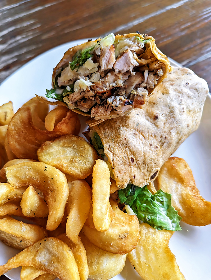 A burrito so perfectly wrapped it could teach a class on organization. Those house-made chips aren't just sides—they're essential companions.