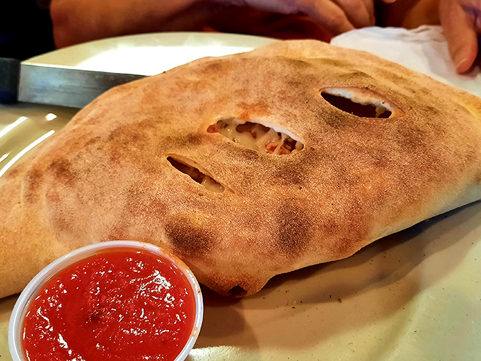 The calzone: Pizza's mysterious, introverted cousin. What treasures hide within that golden-brown exterior? Only one delicious way to find out.