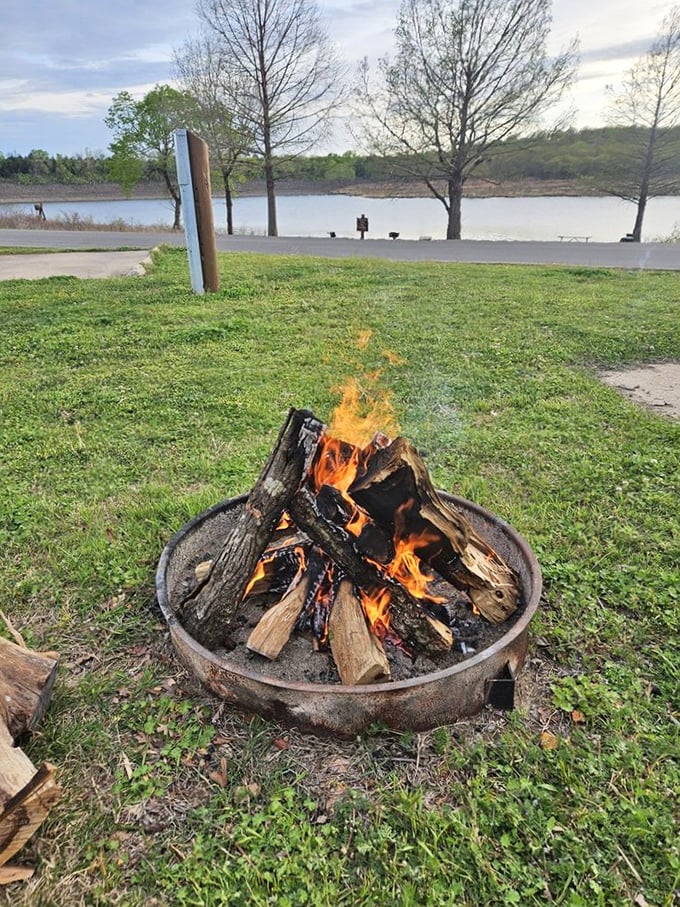 Campfire therapy: where stress dissolves into flames and conversations flow as freely as the nearby waters of Keystone Lake.