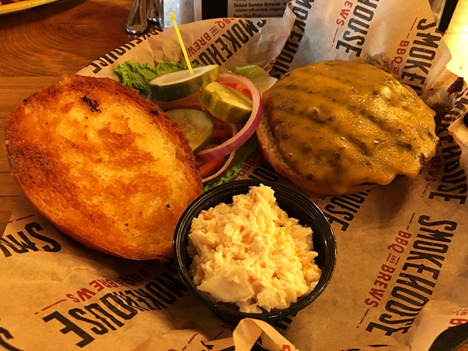 A baked potato the size of your ambitions sits beside a burger that's been kissed by fire. The pimento cheese adds a Southern whisper.