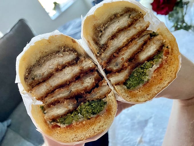 The chicken cutlet sandwich, where perfectly fried poultry meets vibrant broccoli rabe in a handheld masterpiece that makes lunch breaks worth looking forward to.