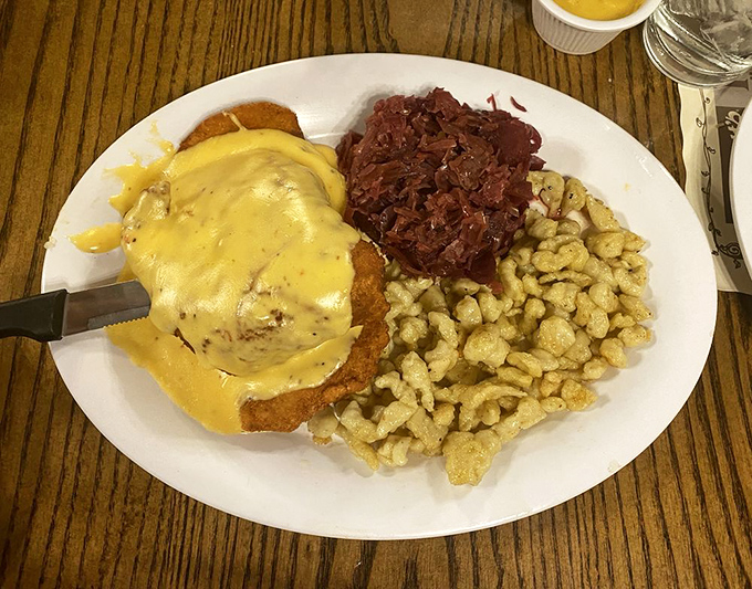 Schnitzel smothered in sauce with red cabbage and sp&auml;tzle&mdash;a plate that would make your German grandmother weep with pride.