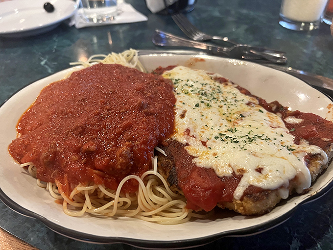 Chicken Parmesan that's achieved the perfect trifecta: crispy exterior, juicy interior, and enough sauce and cheese to make you temporarily forget your name.