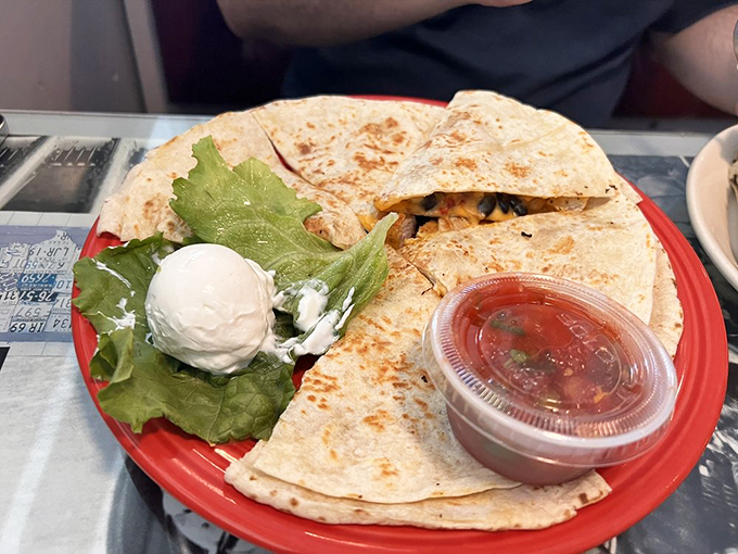 Quesadillas are the unsung heroes of comfort food&mdash;this golden-grilled specimen with its side of sour cream and salsa is ready for its close-up.
