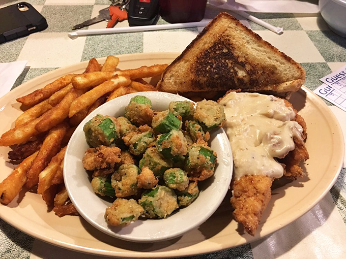 Southern comfort on a plate &ndash; golden fries, crispy chicken, and fried okra that could convert even the most stubborn vegetable skeptics.