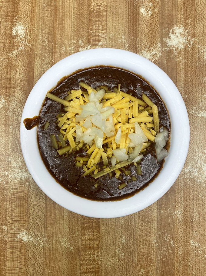 This isn't just chili&mdash;it's a spiced meditation, topped with cheese and onions, that demands to be savored one appreciative spoonful at a time.