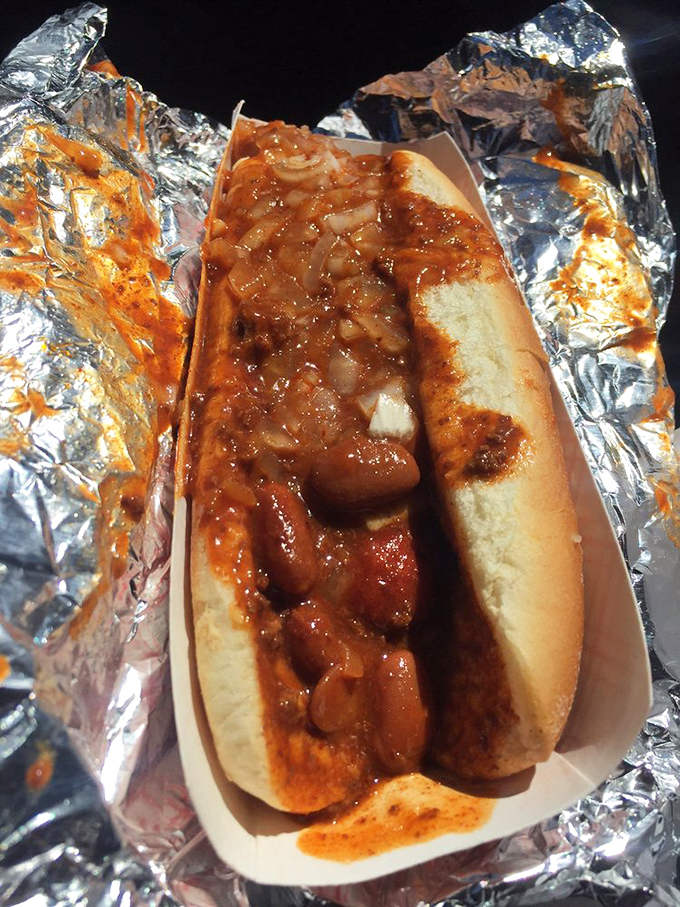 When a chili dog comes wrapped like a present, you know you're about to experience a taste of authentic American roadside bliss.