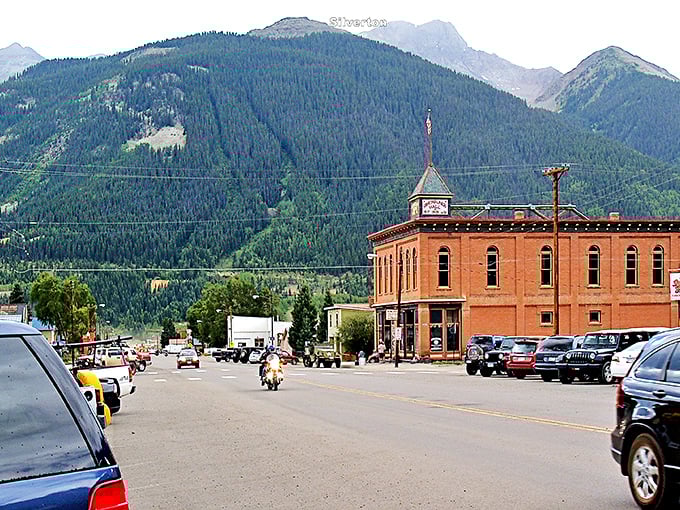Silver Creek winds through towering evergreens like nature's own lazy river, offering peaceful kayaking adventures just minutes from downtown Silverton.