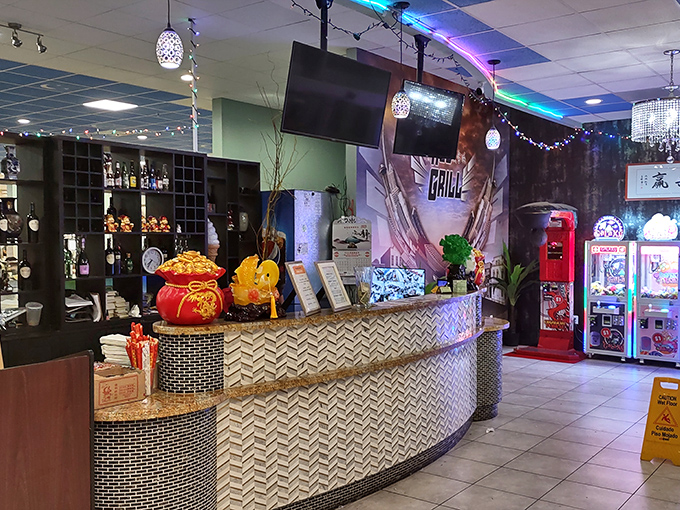The entrance counter&mdash;where they say "hello" and you say "I'll be back for thirds." Note the lucky golden decorations promising good fortune and full bellies. 