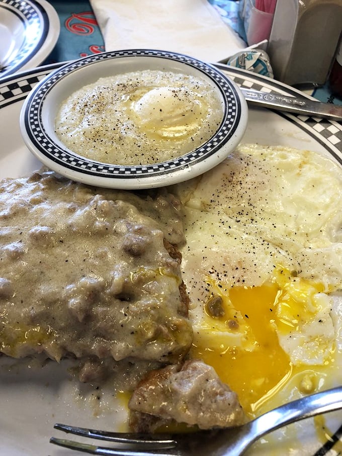 Country fried steak with gravy that could make a vegetarian question their life choices. The biscuit isn't just a side&mdash;it's a gravy delivery system.