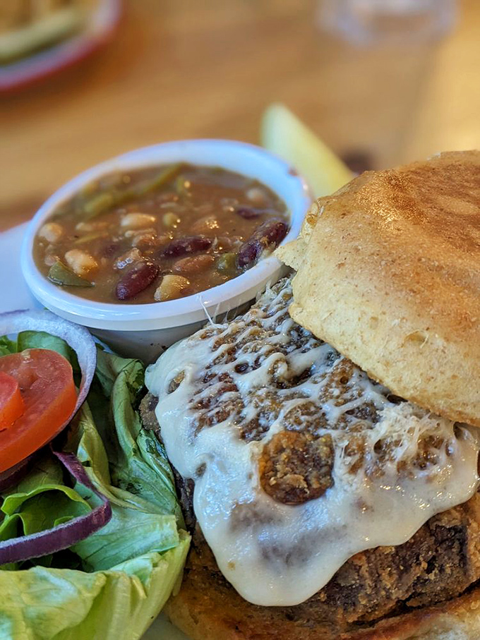 This burger isn't just food&mdash;it's architecture. The melted cheese cascading down the sides is like Niagara Falls if the water were delicious.