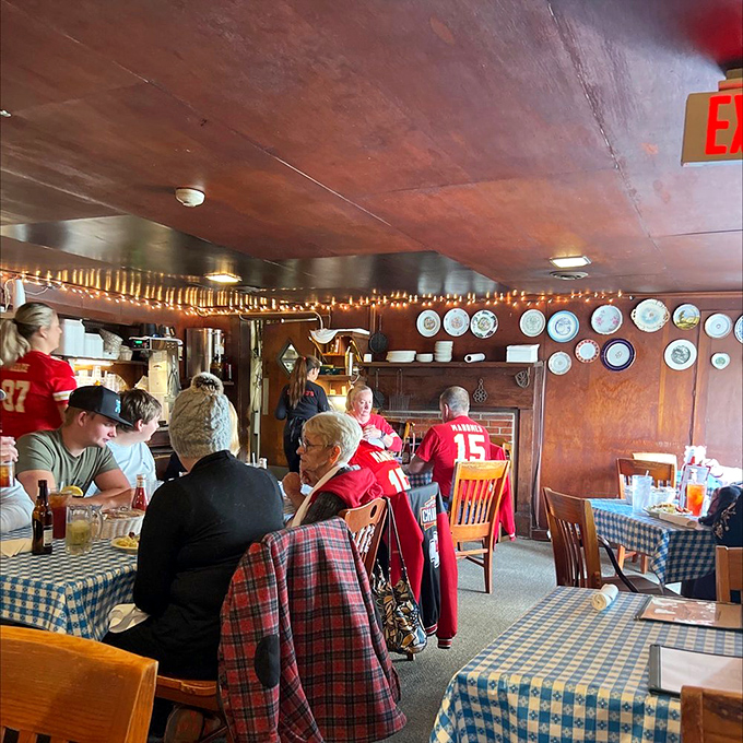 The dining room fills with Chiefs fans and regular folks alike, all united by the universal language of "pass the gravy, please."