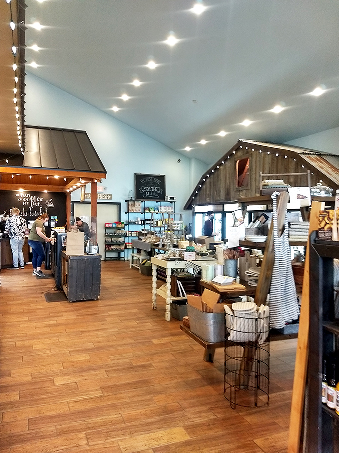 The airy, light-filled interior invites lingering. Notice the barn-inspired design elements that connect the space to its agricultural roots.