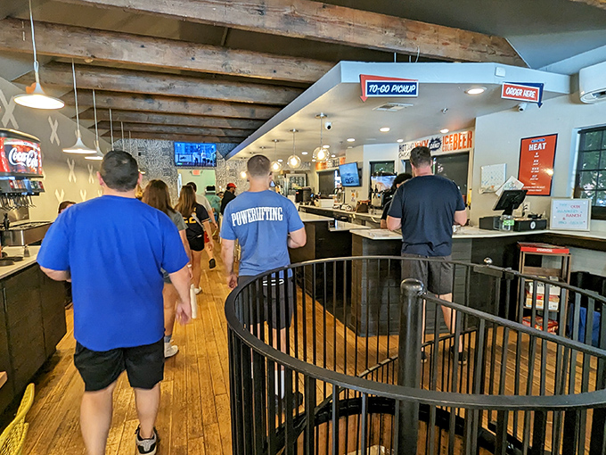 The pilgrimage to poultry paradise requires patience. These customers know that good things come to those who wait in orderly lines.