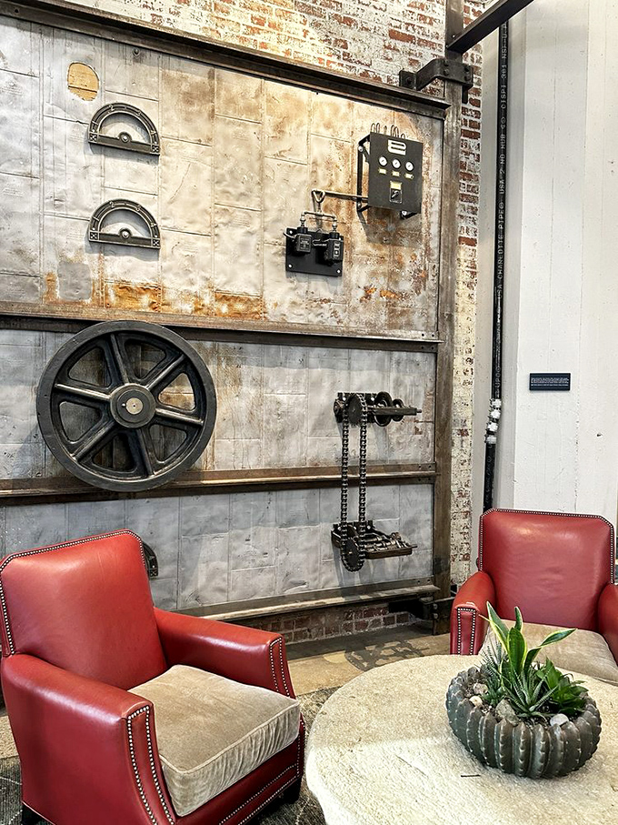 Industrial elements meet cozy comfort in this clever corner. Those red chairs aren't just seating&mdash;they're an invitation to linger over one more coffee.
