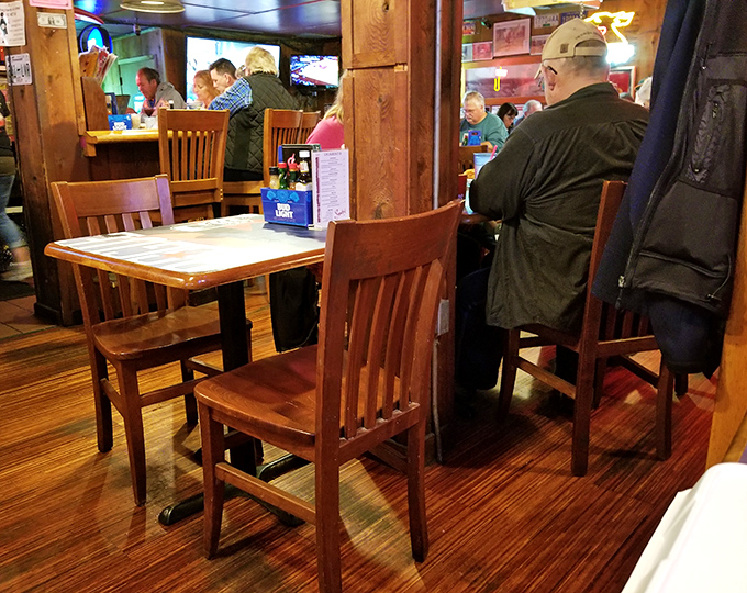 Buffalo wings and tater tots&mdash;proof that sometimes the appetizers deserve to be promoted to main event status. That sauce isn't just orange; it's opportunity.