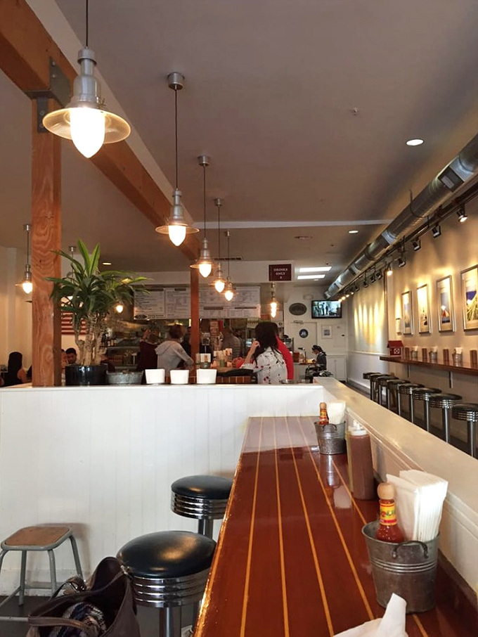 The counter seating offers front-row tickets to the culinary show, where every stool promises a VIP experience.