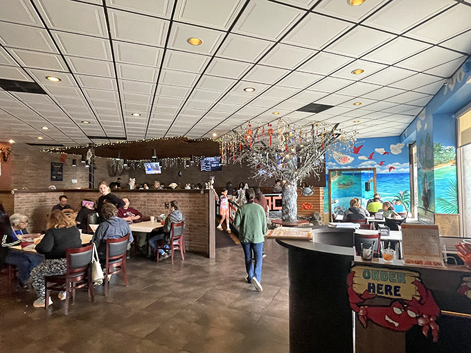 The dining room buzzes with the universal language of seafood satisfaction. Strangers become friends when everyone's wearing a bib.
