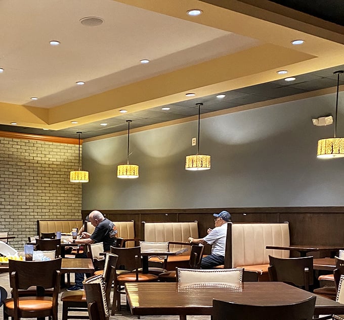 Comfortable booths and thoughtful lighting create an atmosphere where you can contemplate your food choices without judgment from fellow diners.