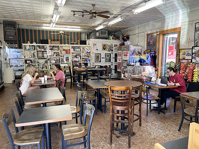 A cross-section of Norman life gathered around simple wooden tables. College students, families, and locals all speak the universal language of "mmmmm."