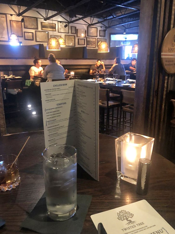 The glow of pendant lighting transforms an ordinary dinner into what feels like a secret society gathering of beef enthusiasts.