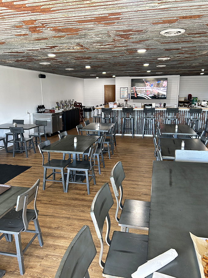 Modern rustic charm with corrugated metal and wood. The kind of space that says "stay awhile" without having to say a word. 