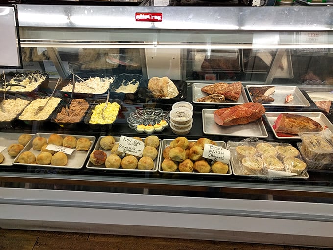 Behind this glass lies the promised land of prepared foods. Knishes and salads await their turn to become someone's perfect lunch.