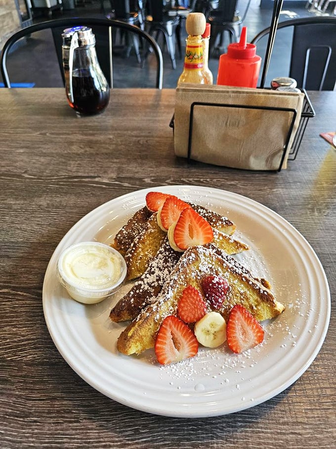 French toast that makes you understand why the French are so smug about food. Those fresh strawberries and powdered sugar aren't just garnish&mdash;they're a declaration of deliciousness.