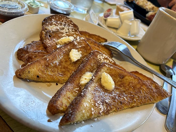 French toast that's been given the VIP treatment&mdash;crispy edges, custardy centers, and enough butter to make your cardiologist wince but your soul sing.