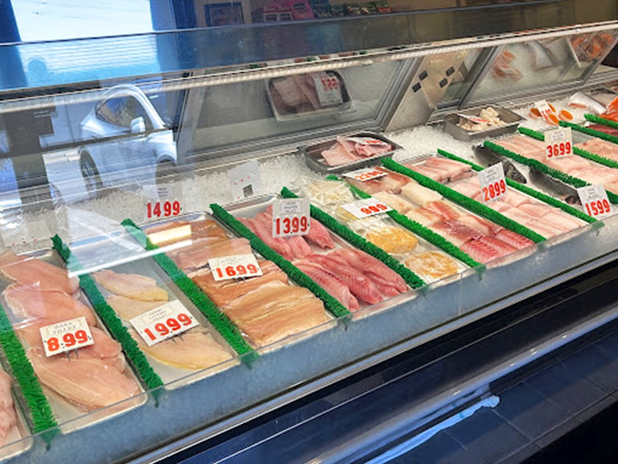 Fresh fish lined up like colorful contestants in a beauty pageant. Each fillet tells a story of early morning boats and skilled hands.