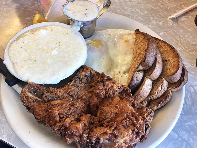 The fried pork chop breakfast is what Southern comfort looks like on a plate. If this doesn't cure what ails you, you might need actual medicine.