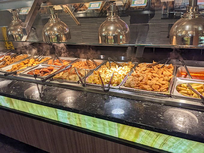 Heat lamps stand guard over golden-fried treasures like dragons protecting their hoard. That steam isn't just vapor&mdash;it's anticipation made visible.