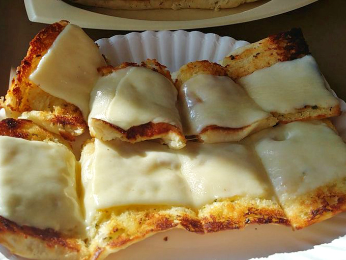 Garlic cheese bread done right is practically its own food group. Golden, gooey, and guaranteed to ruin any chance of a goodnight kiss.