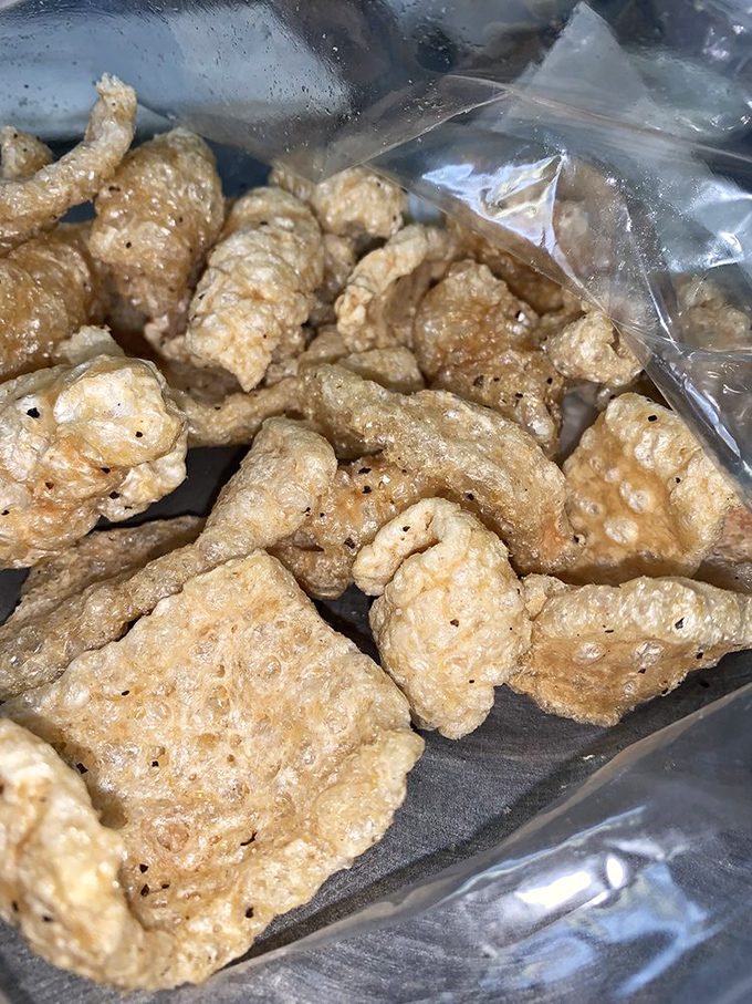 House-fried pork rinds that shatter with satisfying crispness. These aren't your gas station variety&mdash;they're the difference between a cover band and the original artist.