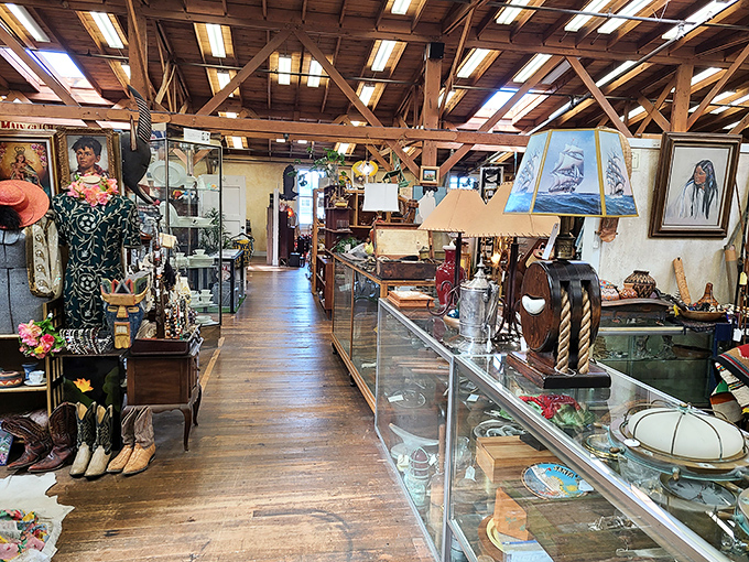 Wooden beams frame aisles of glass cases where maritime artifacts and collectibles tell stories of Monterey's storied relationship with the sea.