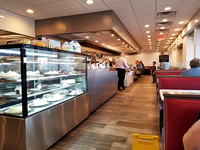 Red vinyl booths that have cradled conversations from first dates to retirement celebrations. If these seats could talk, they'd need their own podcast. 