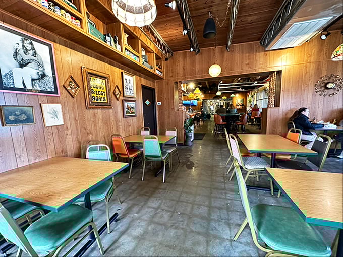 Retro-cool chairs in seafoam green and orange pop against wood-paneled walls. It's like the Brady Bunch vacation home reimagined as a taco paradise.