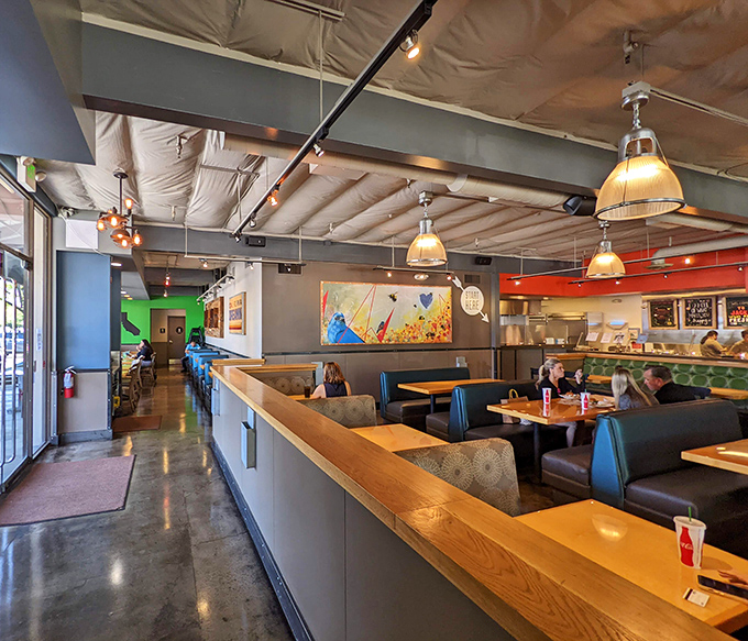 The dining room's warm lighting makes everyone look like they're in a food commercial. Even your hangry face looks good here.