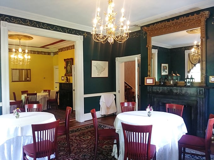 Deep green walls and gleaming wood create dining rooms with character. This isn't just a restaurant&mdash;it's a series of intimate stages for culinary theater.