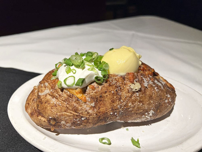 Not just any potato &ndash; this loaded spud comes dressed for the occasion with sour cream, butter, green onions, and a dollop of pure comfort.