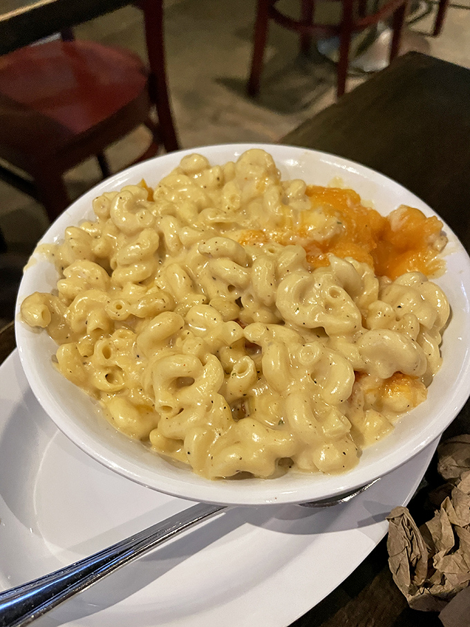 Mac and cheese so gloriously excessive it should come with its own cardiologist's business card. Worth every creamy, cheesy calorie.