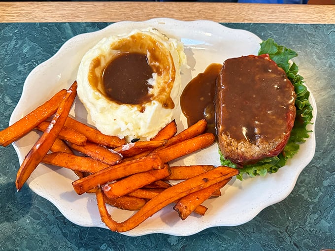 This apple dumpling isn't just dessert &ndash; it's a warm hug on a plate, complete with a scoop of ice cream melting into all the right places.