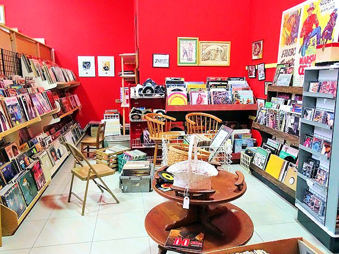 A vinyl lover's paradise painted in passionate red. These records aren't just music&mdash;they're physical memories you can hold and hear.