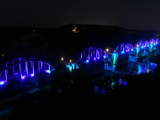 Electric blue illumination transforms nighttime Cotter into something otherworldly. Who needs Broadway when you've got this light show?